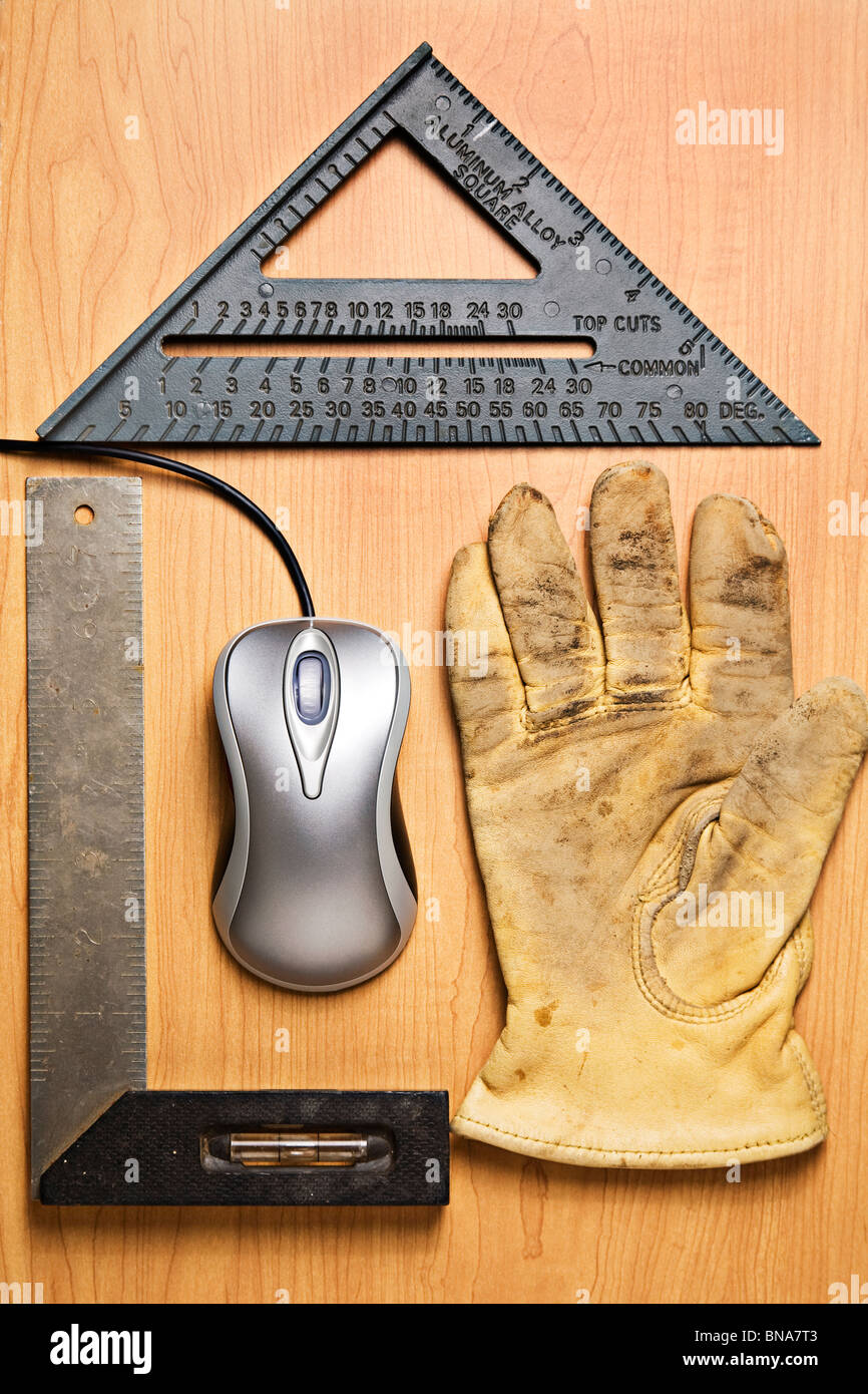 Computer mouse and old tools placed to resemble a house Stock Photo - Alamy