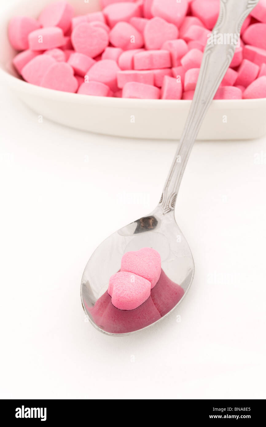 Pink Heart Shape Candy, Concept of Love Pill Stock Photo - Alamy
