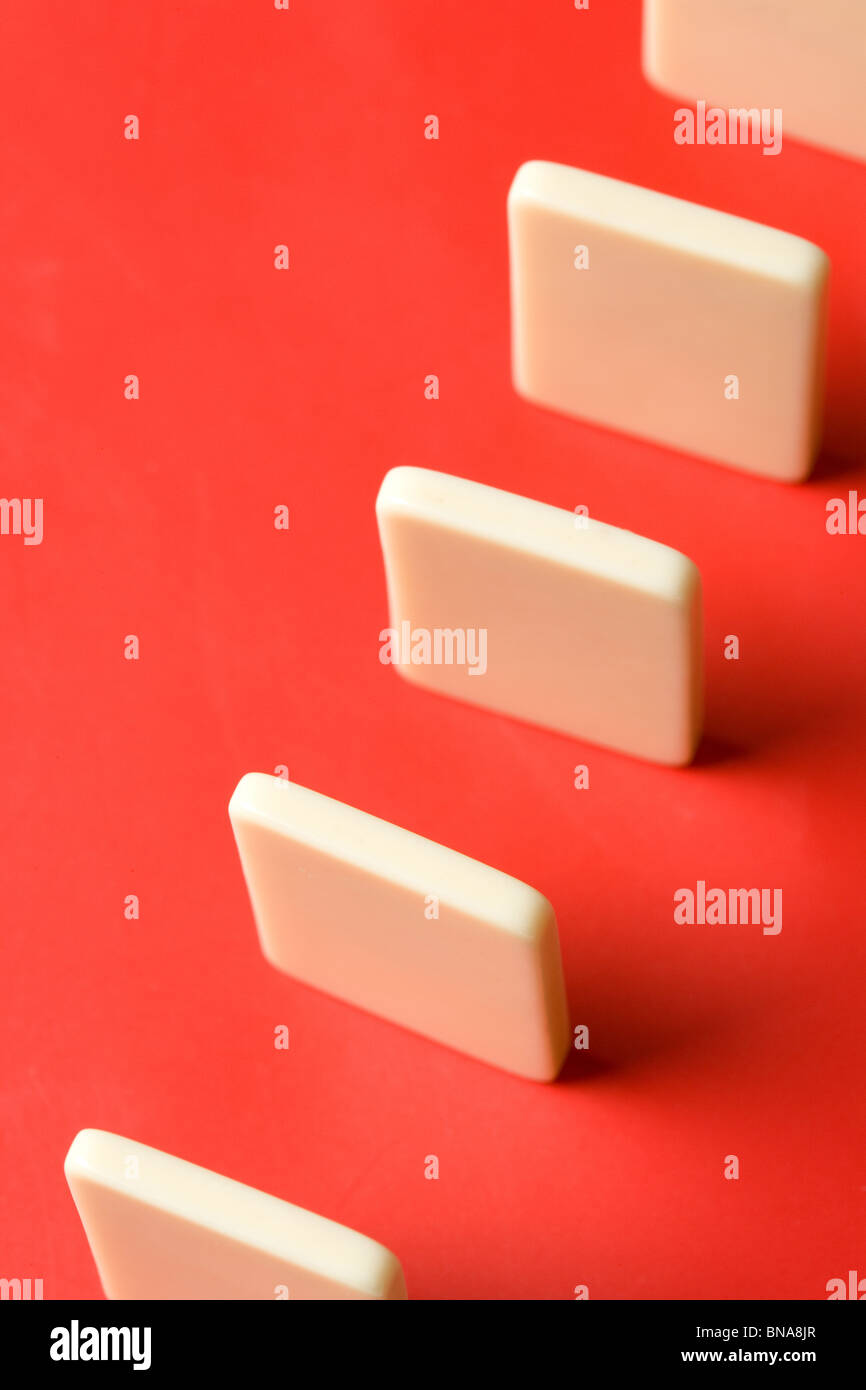 Domino with red background, Concept of Cause or Teamwork Stock Photo ...