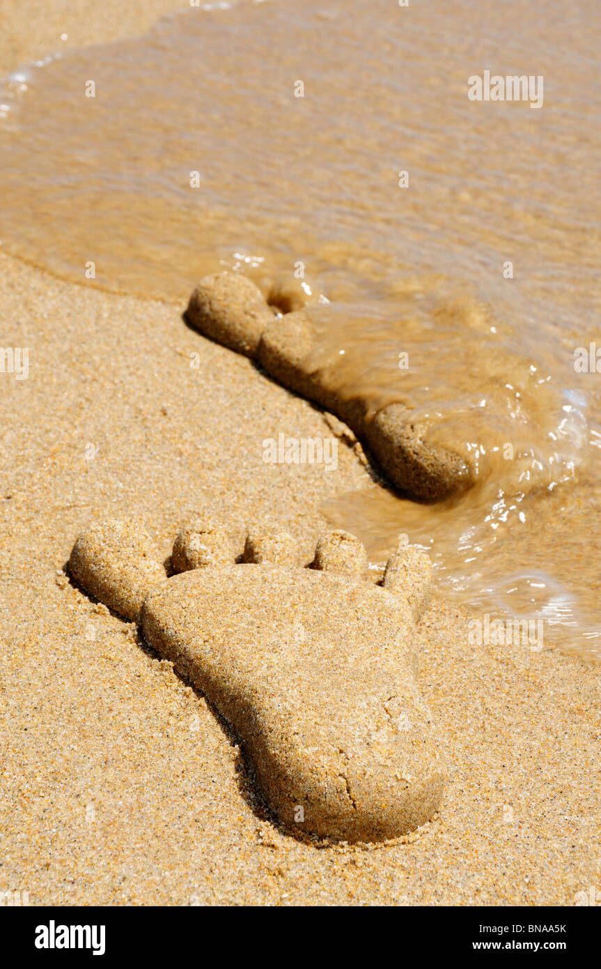 footprints in the sand on a beach Stock Photo - Alamy