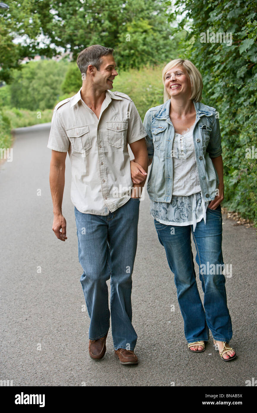 Couple on country walk Stock Photo - Alamy