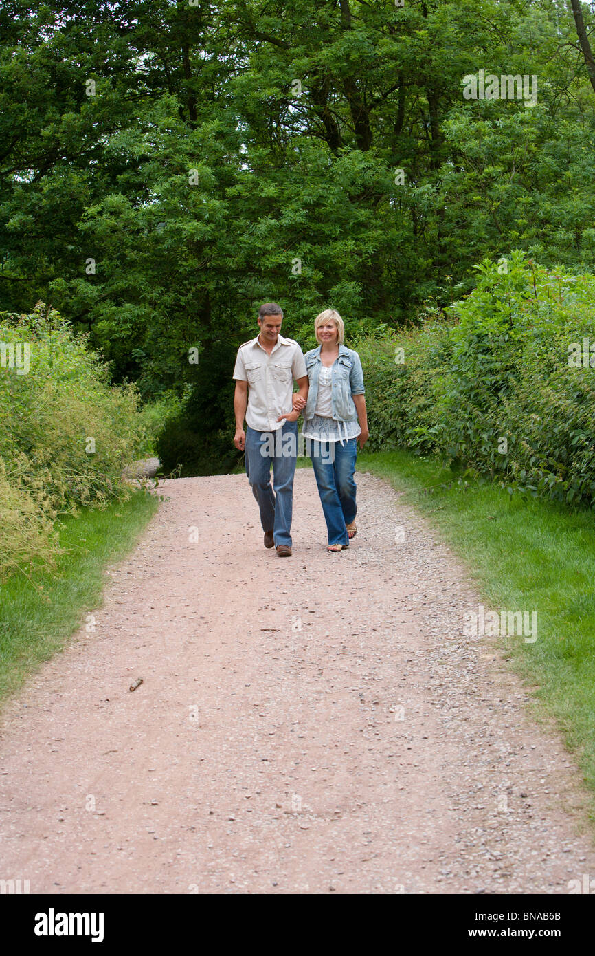 Couple on country walk Stock Photo - Alamy