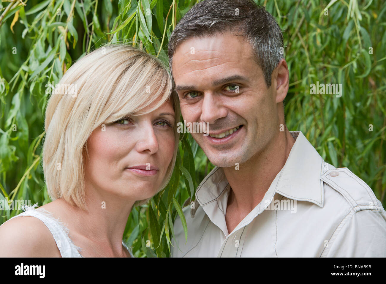 Couple heads together Stock Photo - Alamy