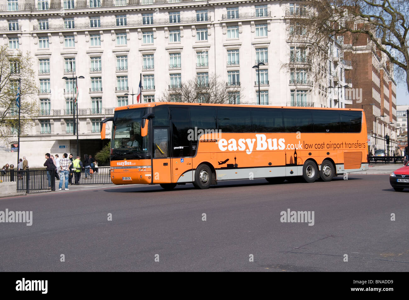 A three Axle coach operated by Arriva and painted in easybus colours is ...