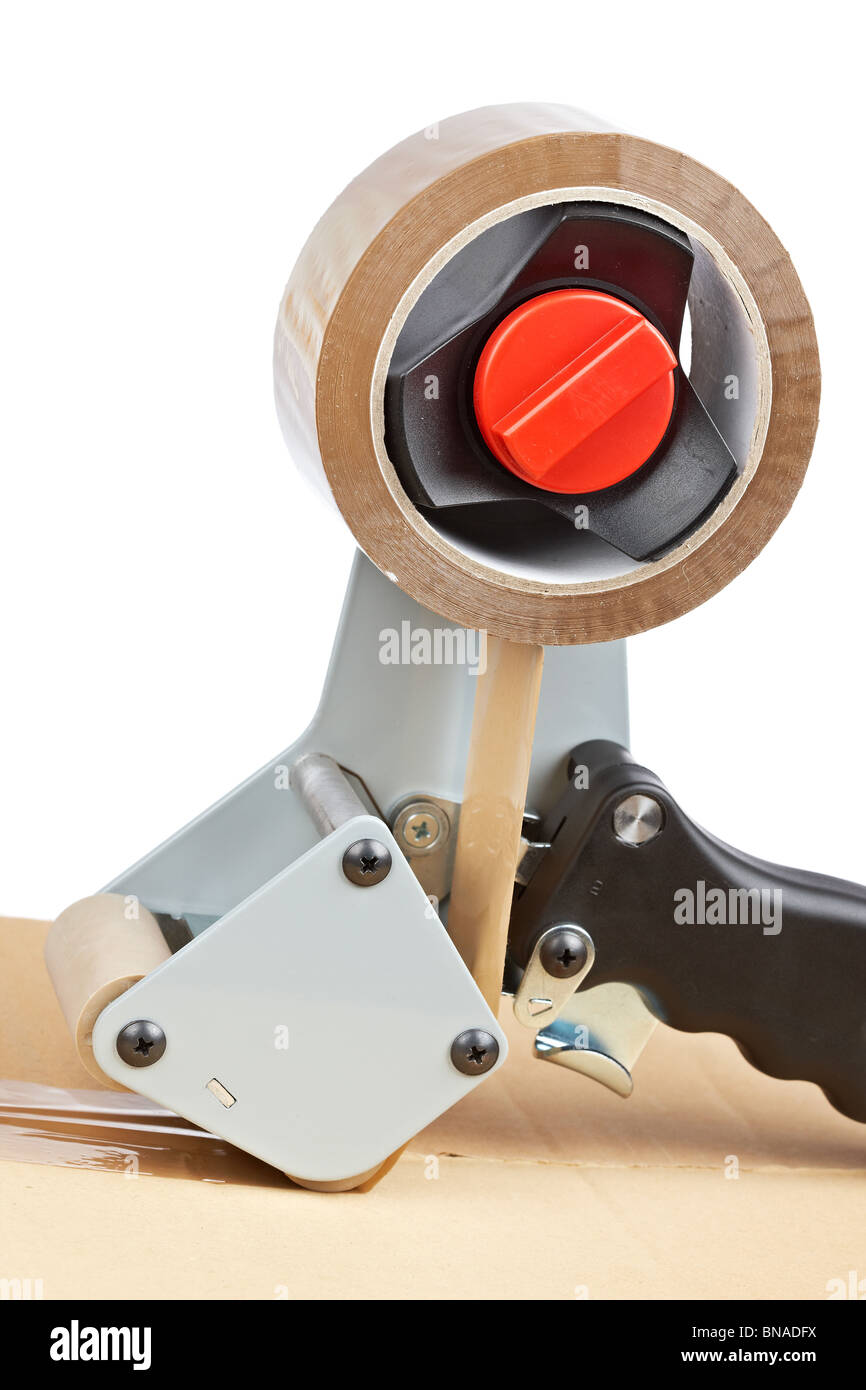 Packaging tape dispenser and shipping box isolated on white background ...