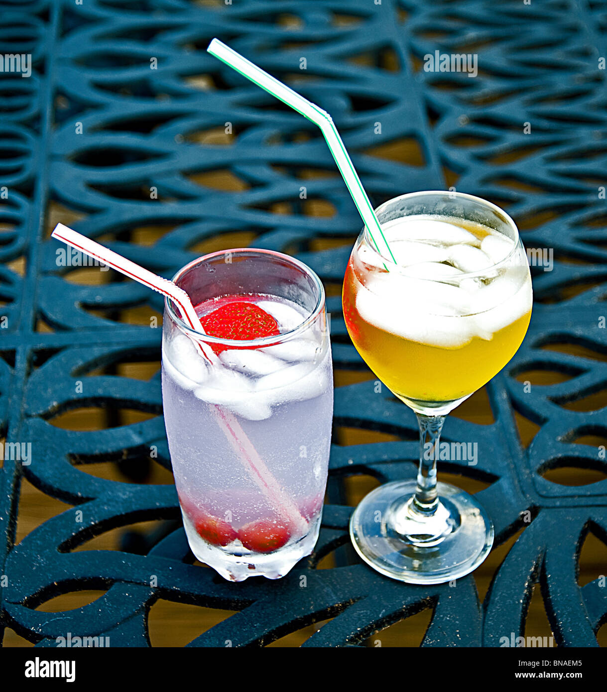 two drinks gin tonic ice strawberry margarita cocktail table top ...