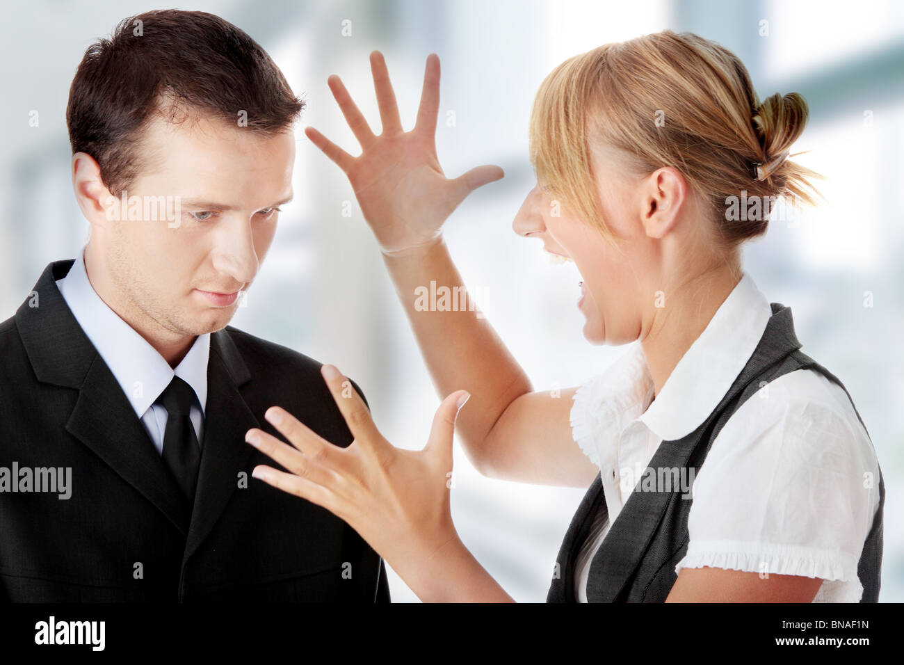 Work Colleagues arguing on white background Stock Photo - Alamy