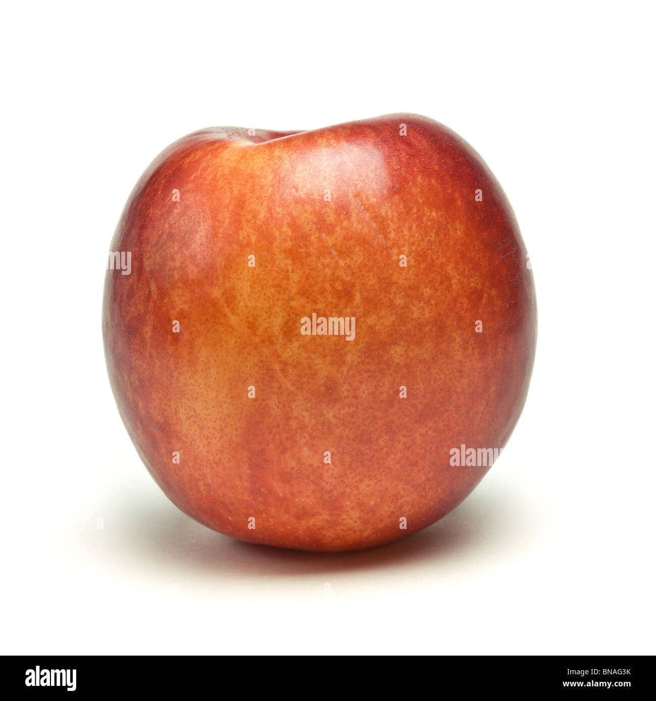 fresh vibrant Nectarine from low perspective isolated against white ...
