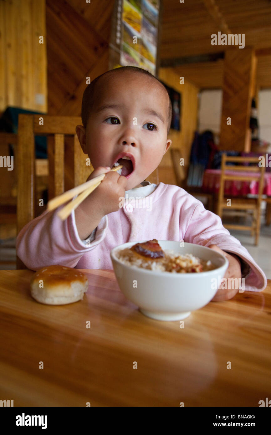 Child eating china chopsticks hi-res stock photography and images - Alamy