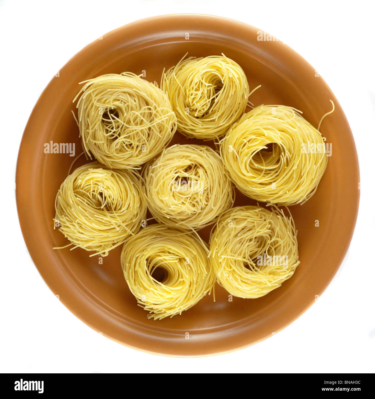 Orange plate on textured Cut Out Stock Images & Pictures - Alamy