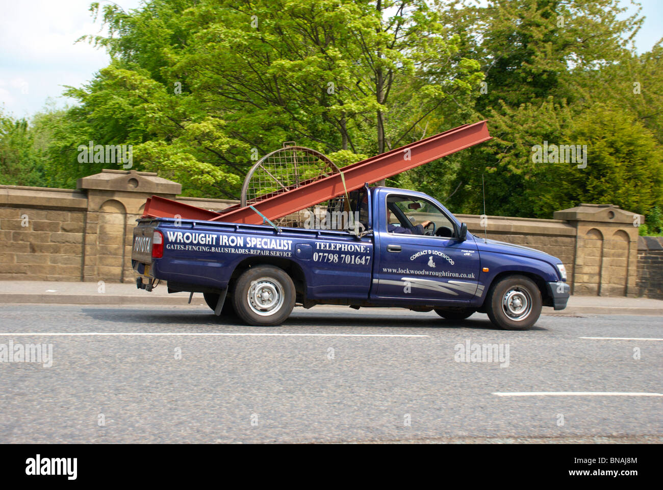 Pick-up truck carrying iron / steel products Stock Photo - Alamy