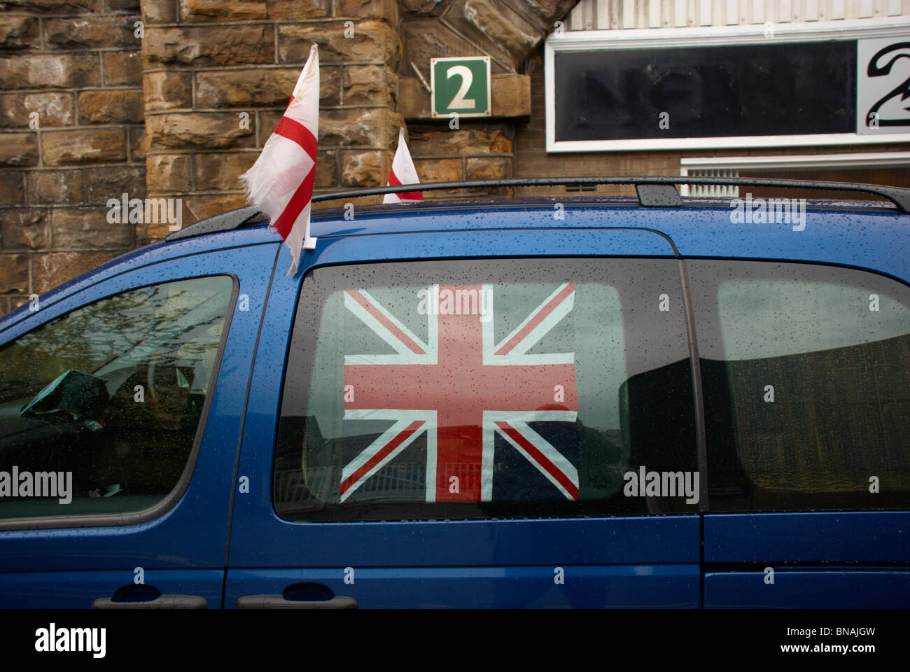 flag in car window Stock Photo - Alamy