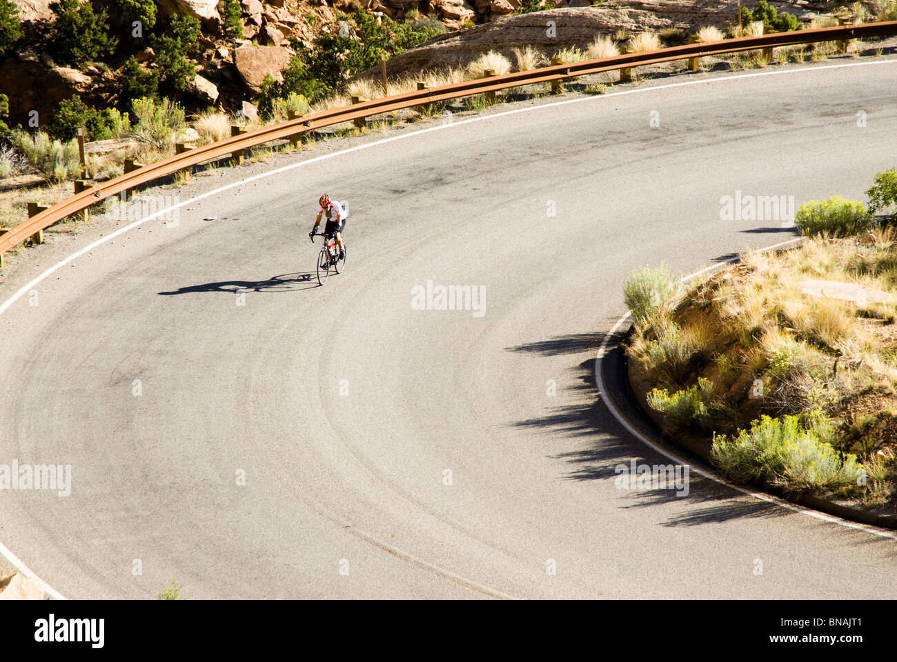 A biker rides on the scenic Rim Rock Drive in Colorado National ...