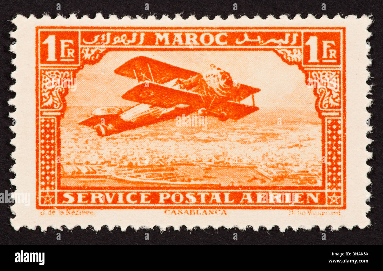 Postage stamp from Morocco depicting a biplane Stock Photo - Alamy