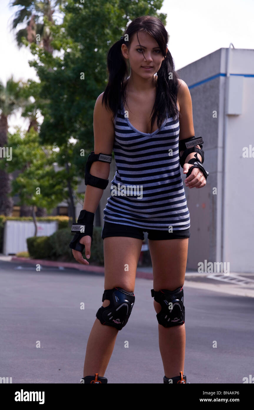 Young woman roller blading Stock Photo - Alamy