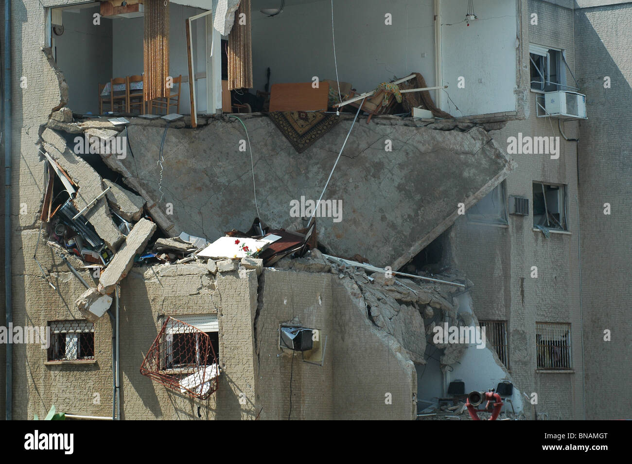 A residential building shows severe damage after it was directly hit by ...