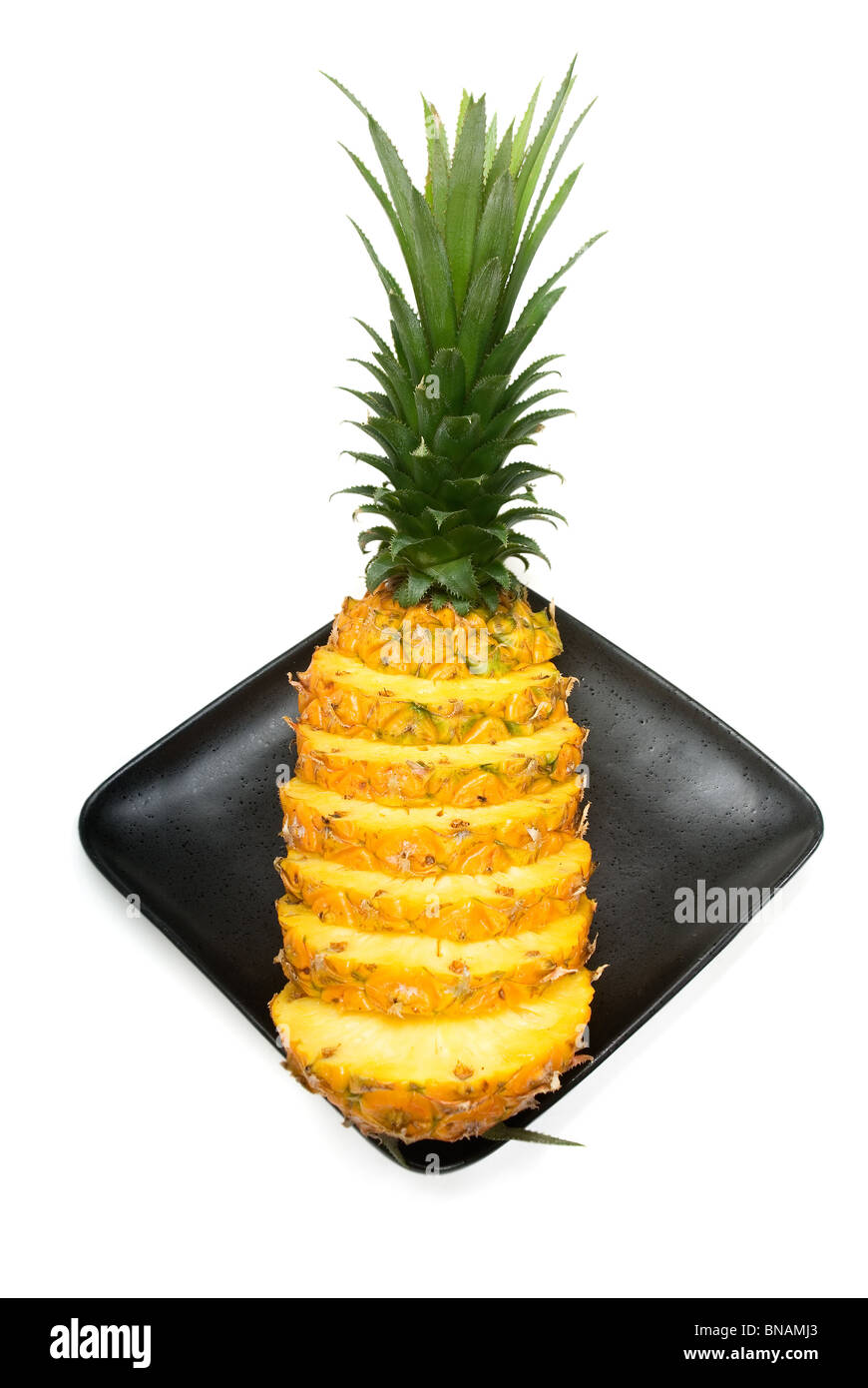ripe vivid pineapple sliced isolated over white background Stock Photo ...