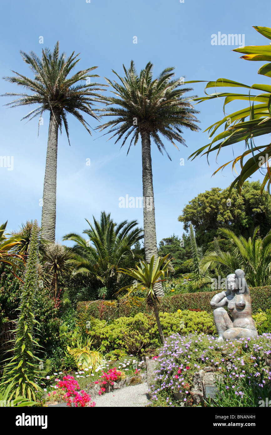 Tresco Abbey gardens palm trees and the marble statue of Gaia Stock ...