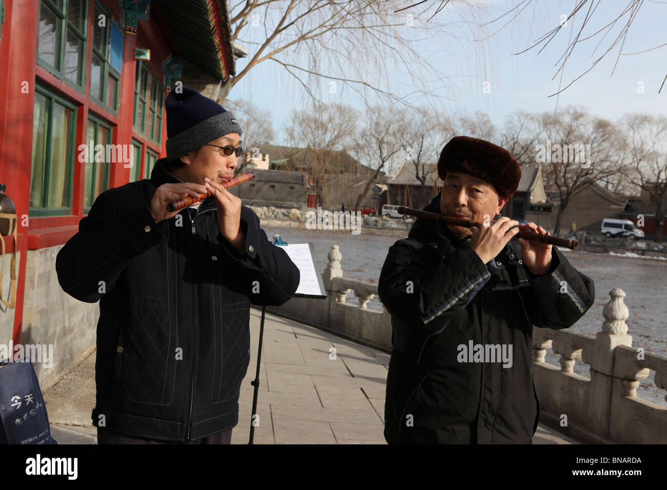 China chinese man playing flute hi-res stock photography and images - Alamy