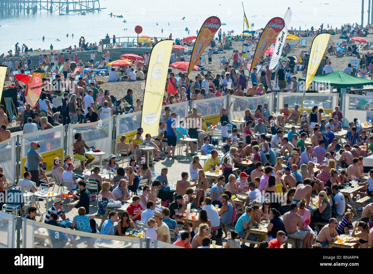 Crowded bars and pebled beach, Brighton, East Sussex, United Kingdom ...