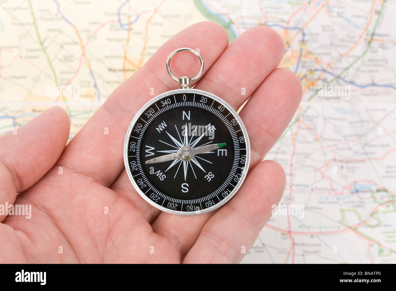 Compass and map close up shot Stock Photo - Alamy