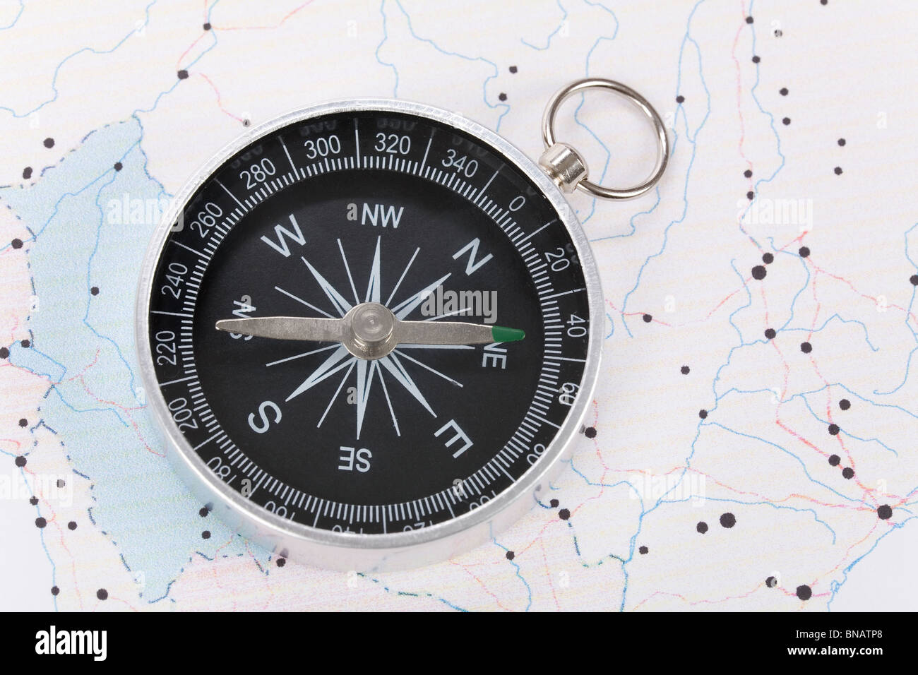 Compass and map close up shot Stock Photo - Alamy