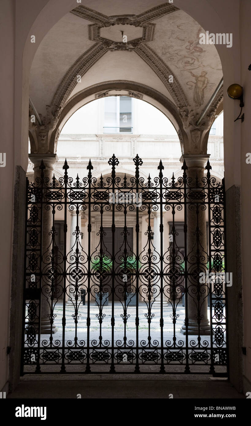Wrought-iron gate, courtyard in centre of Milan, Italy Stock Photo - Alamy