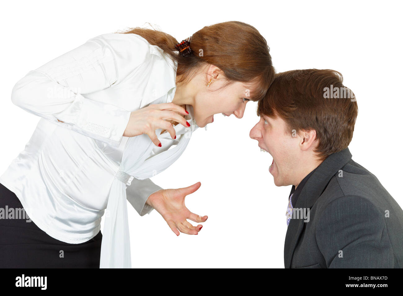 Shouting at each other man and woman on white background Stock Photo ...