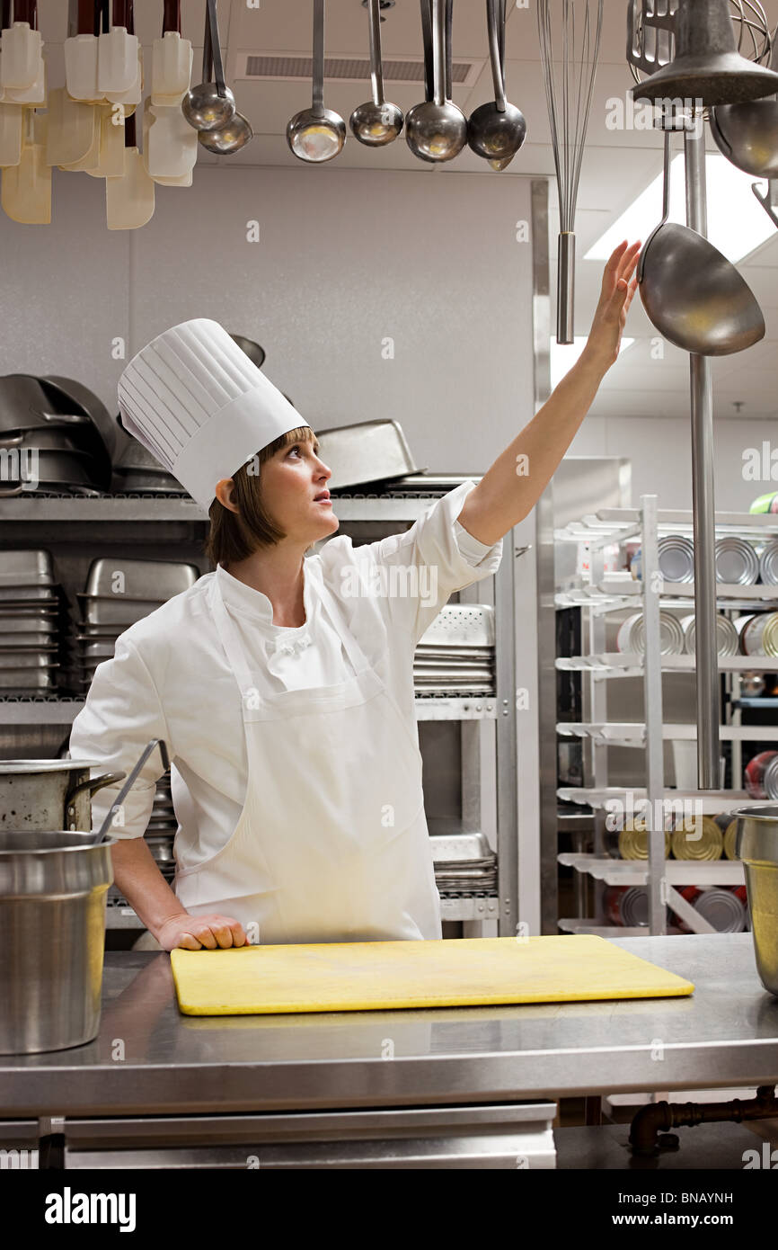 Female chef working in commercial kitchen Stock Photo - Alamy