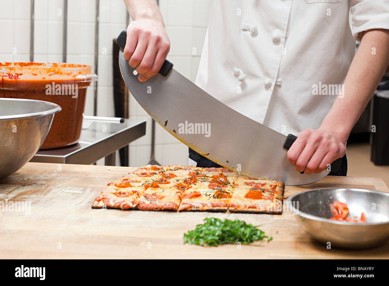 Cropped view cook cutting pizza hi-res stock photography and images - Alamy