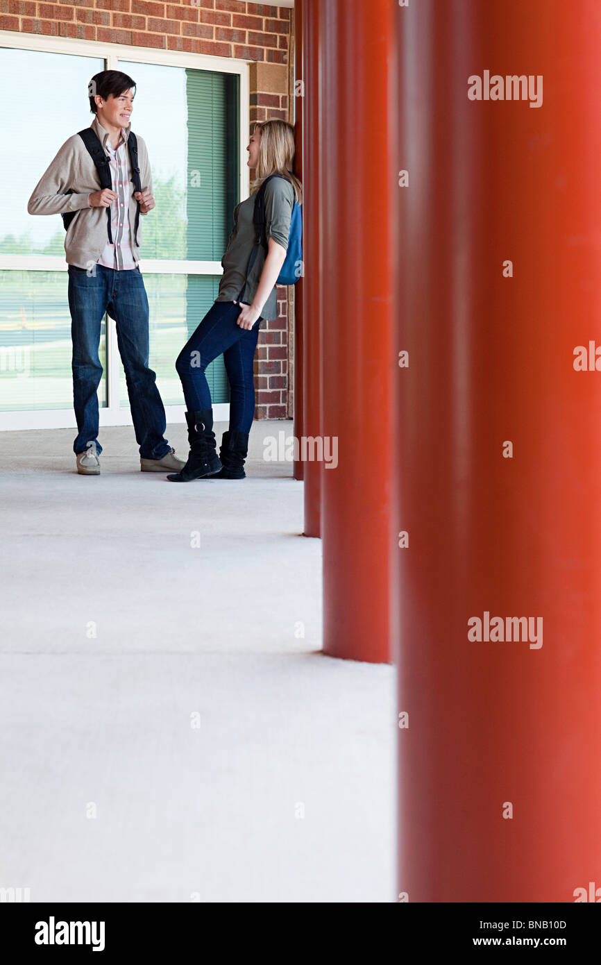 High school classmates talking Stock Photo - Alamy