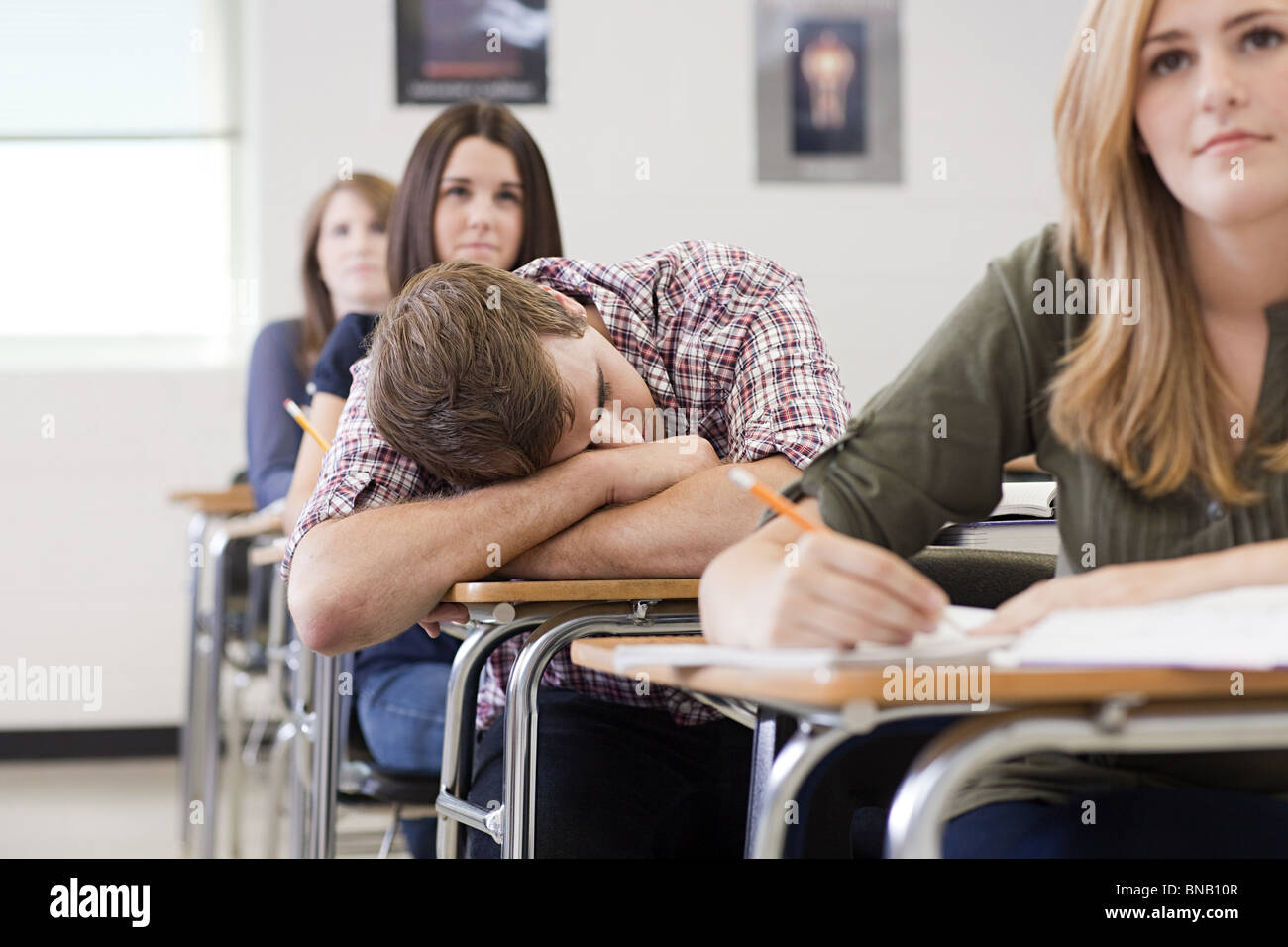 Male high school student asleep in class Stock Photo - Alamy