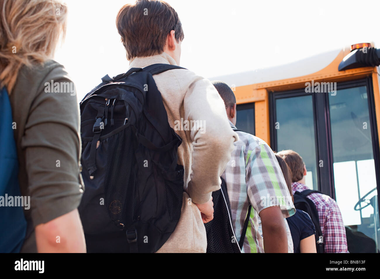 High school students queuing for school bus Stock Photo - Alamy