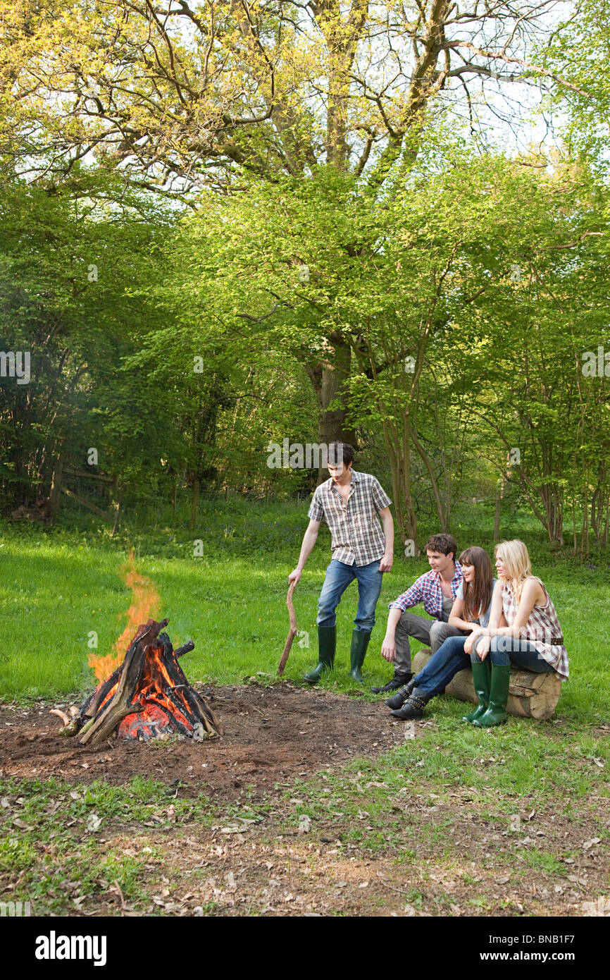 Friends by campfire Stock Photo - Alamy