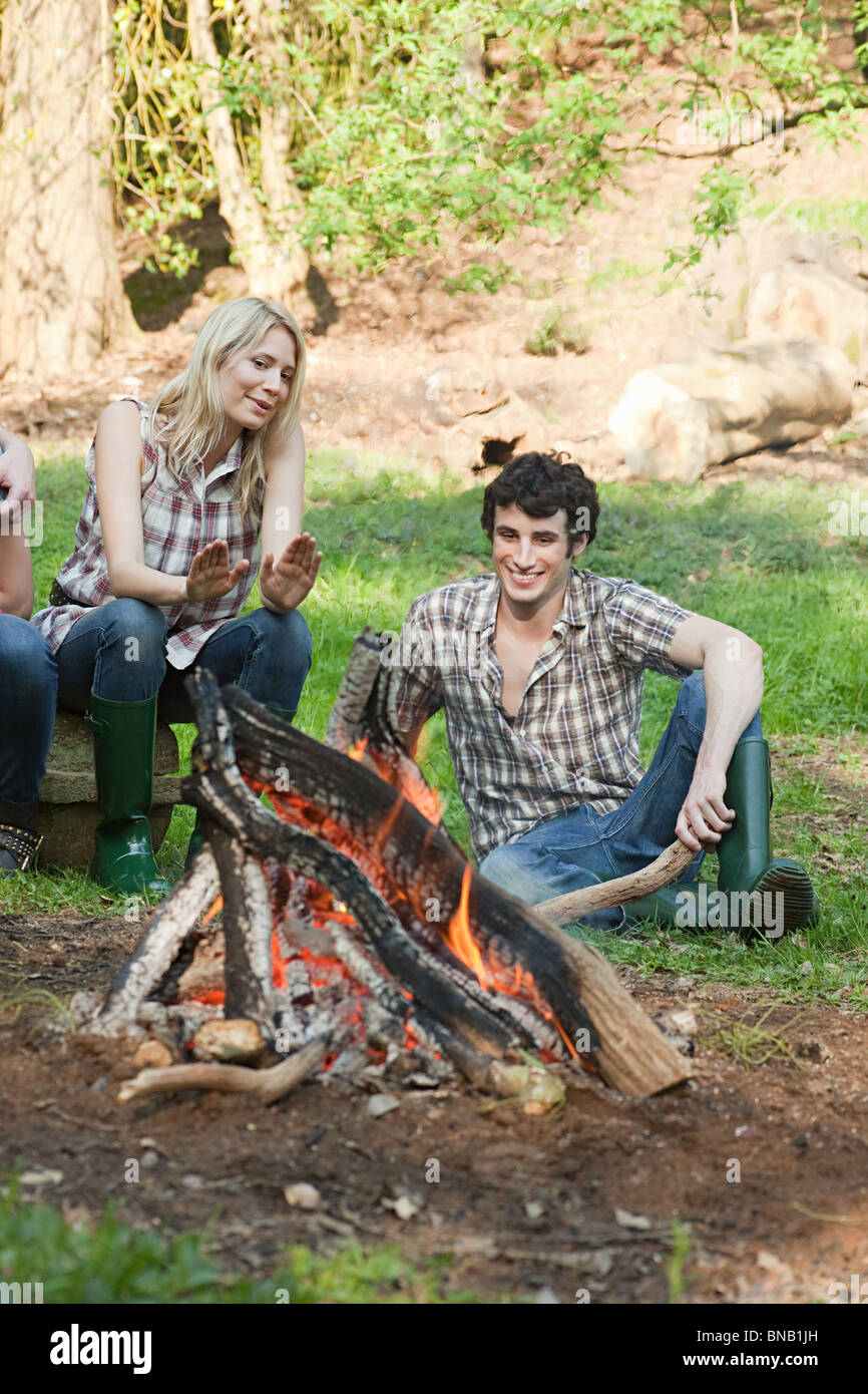 Friends by campfire Stock Photo - Alamy