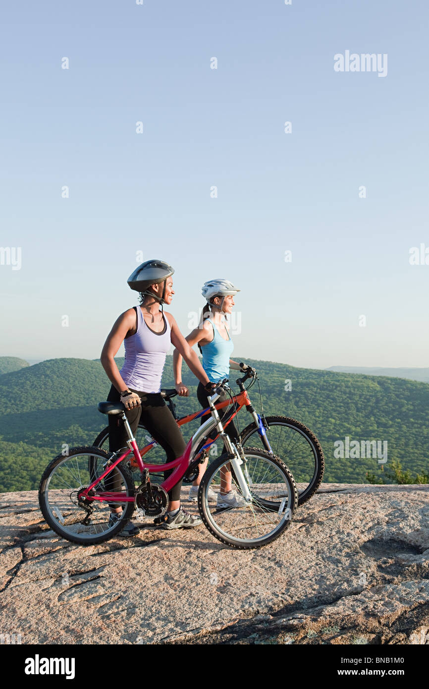 Two female cyclists, rural scene Stock Photo - Alamy