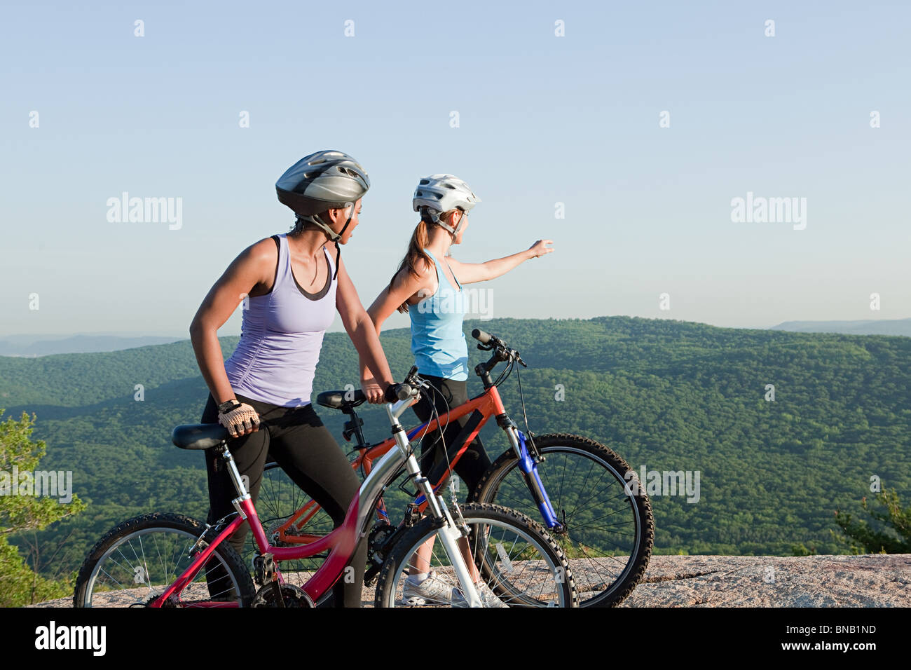 Two female cyclists, rural scene Stock Photo - Alamy