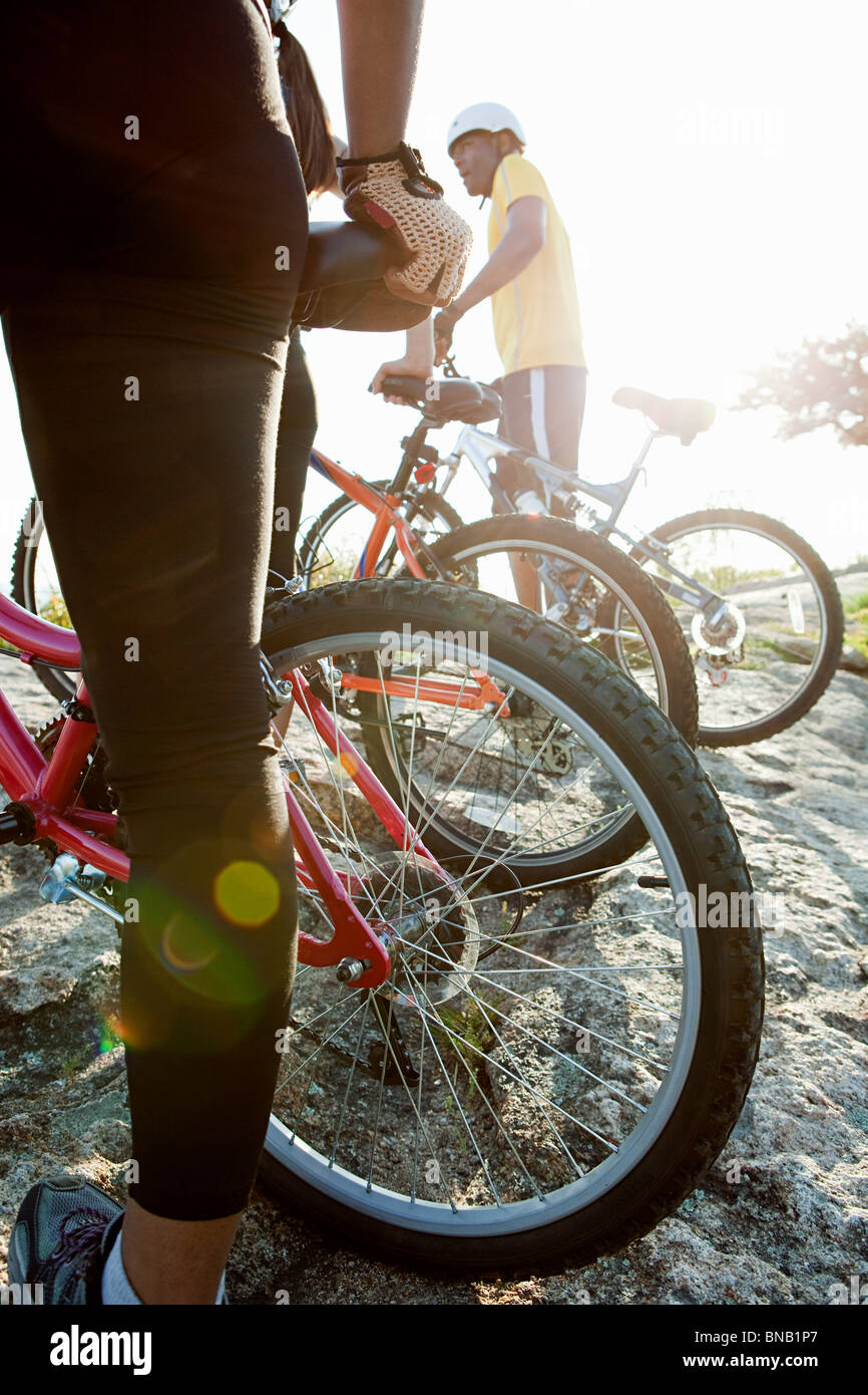 Two cyclists standing with bikes Stock Photo - Alamy