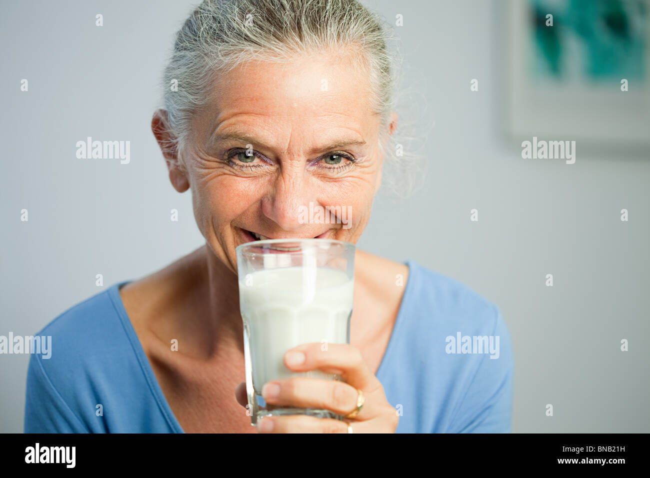 Mature woman drinking milk hi-res stock photography and images - Alamy