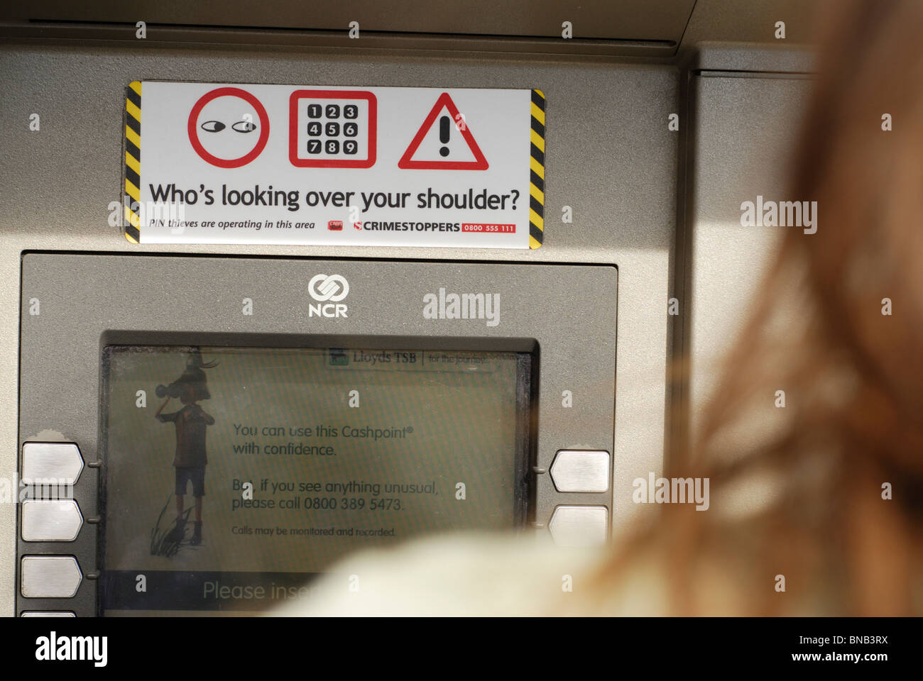 ATM cash machine looking over shoulder Stock Photo - Alamy