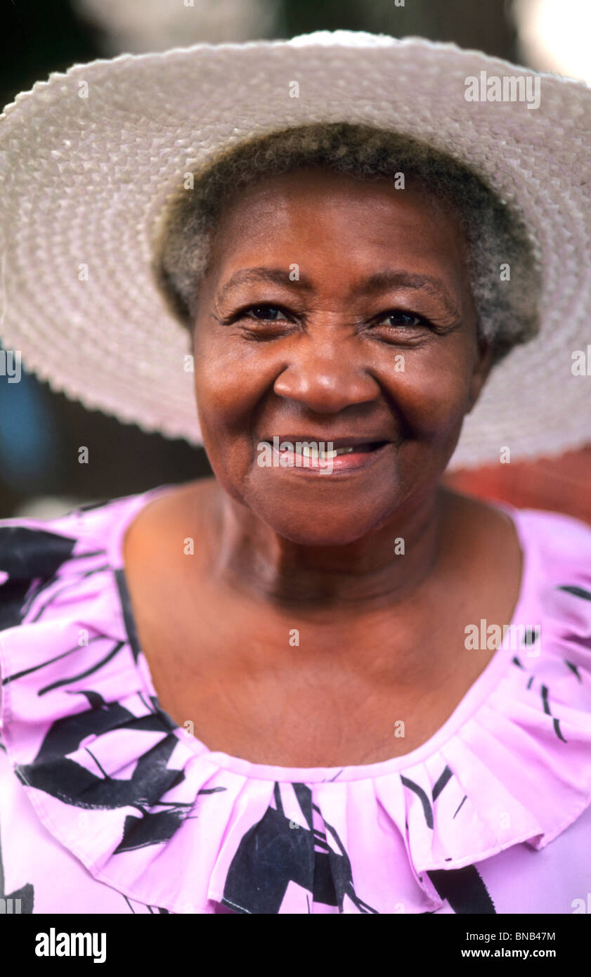 Colorful local woman in hat smiling portrait in the beautiful village ...