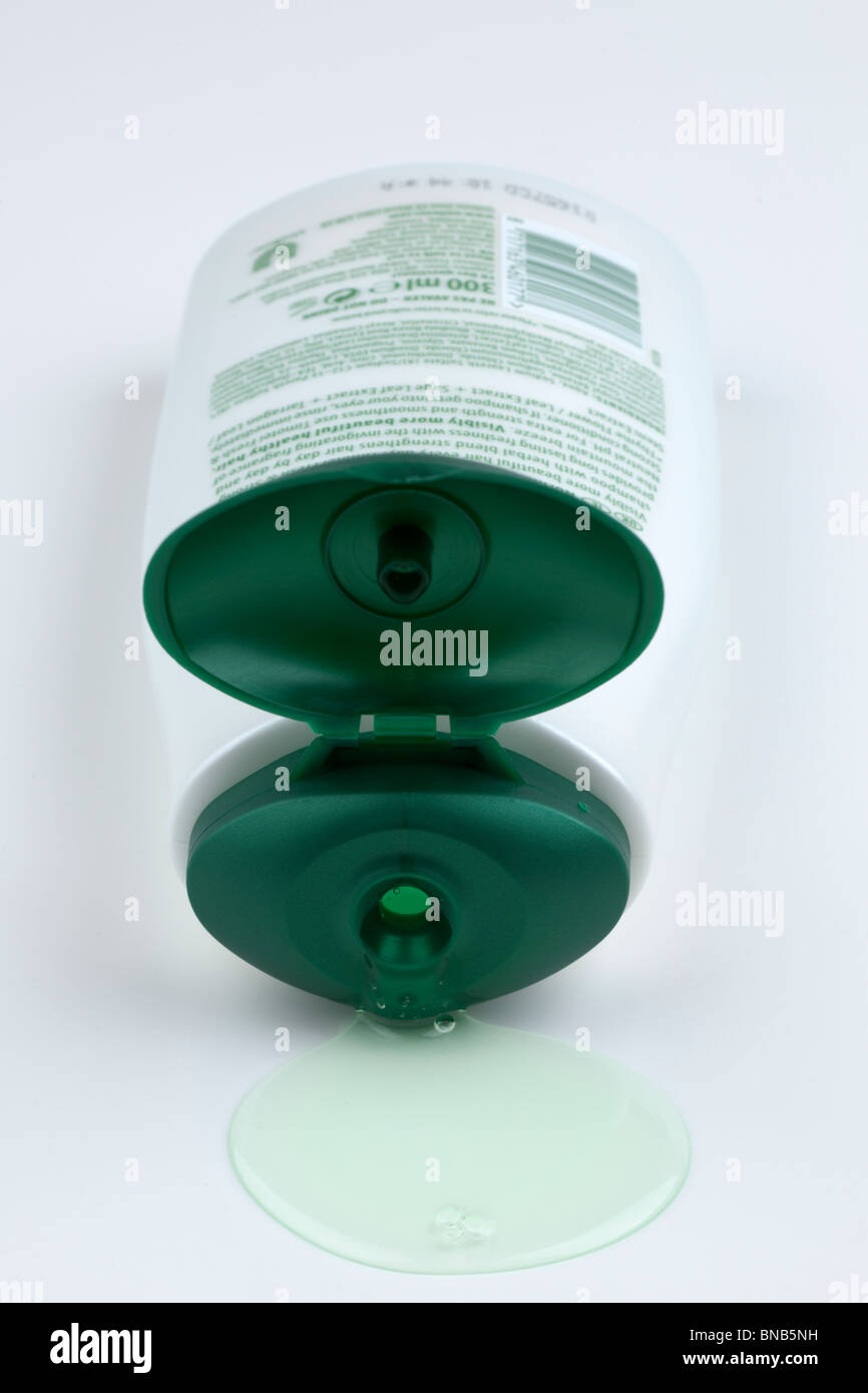 Green shampoo spilling from bottle hi-res stock photography and images ...