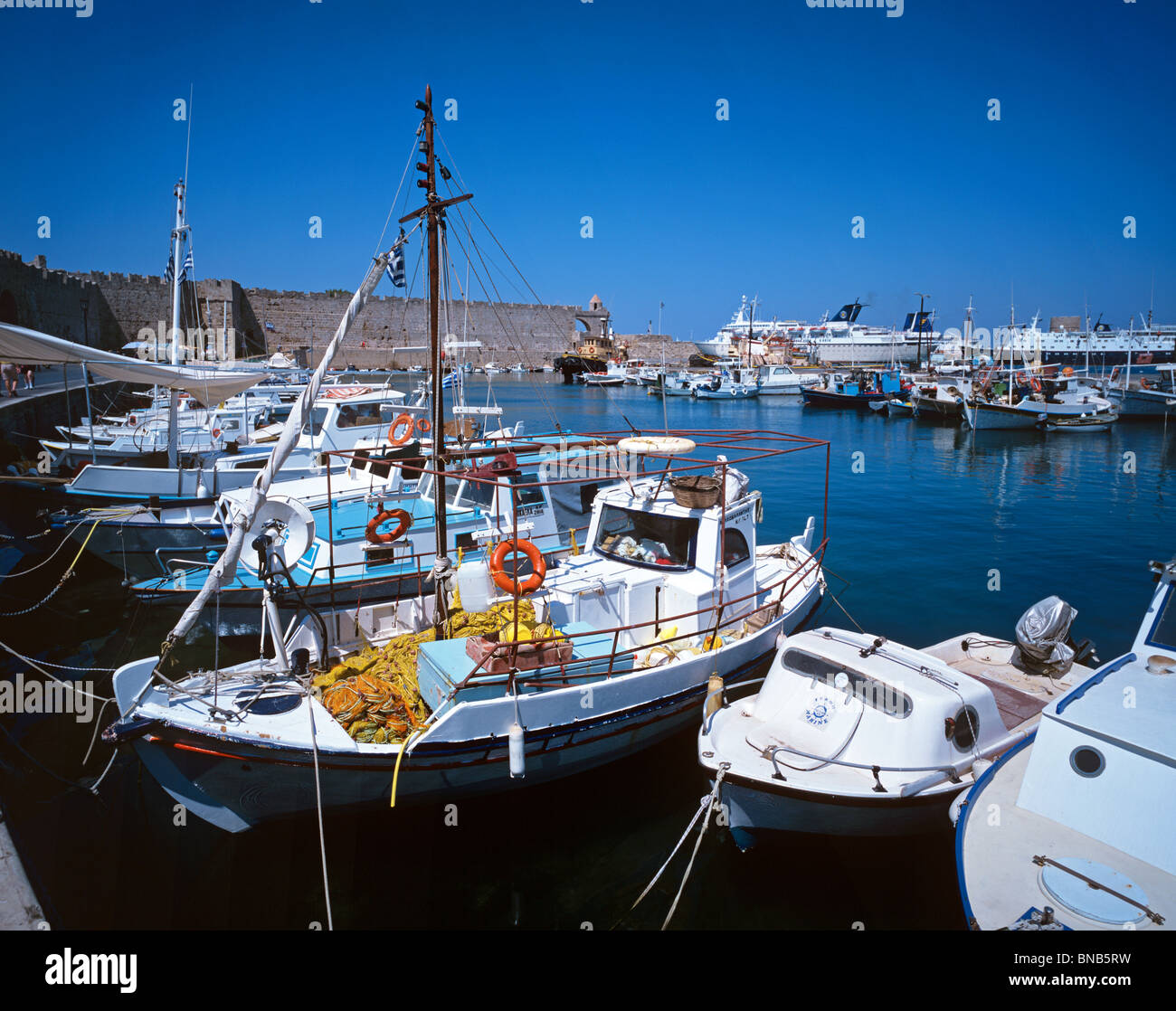 Rhodes Town - Boats in Mandraki Harbour Stock Photo - Alamy