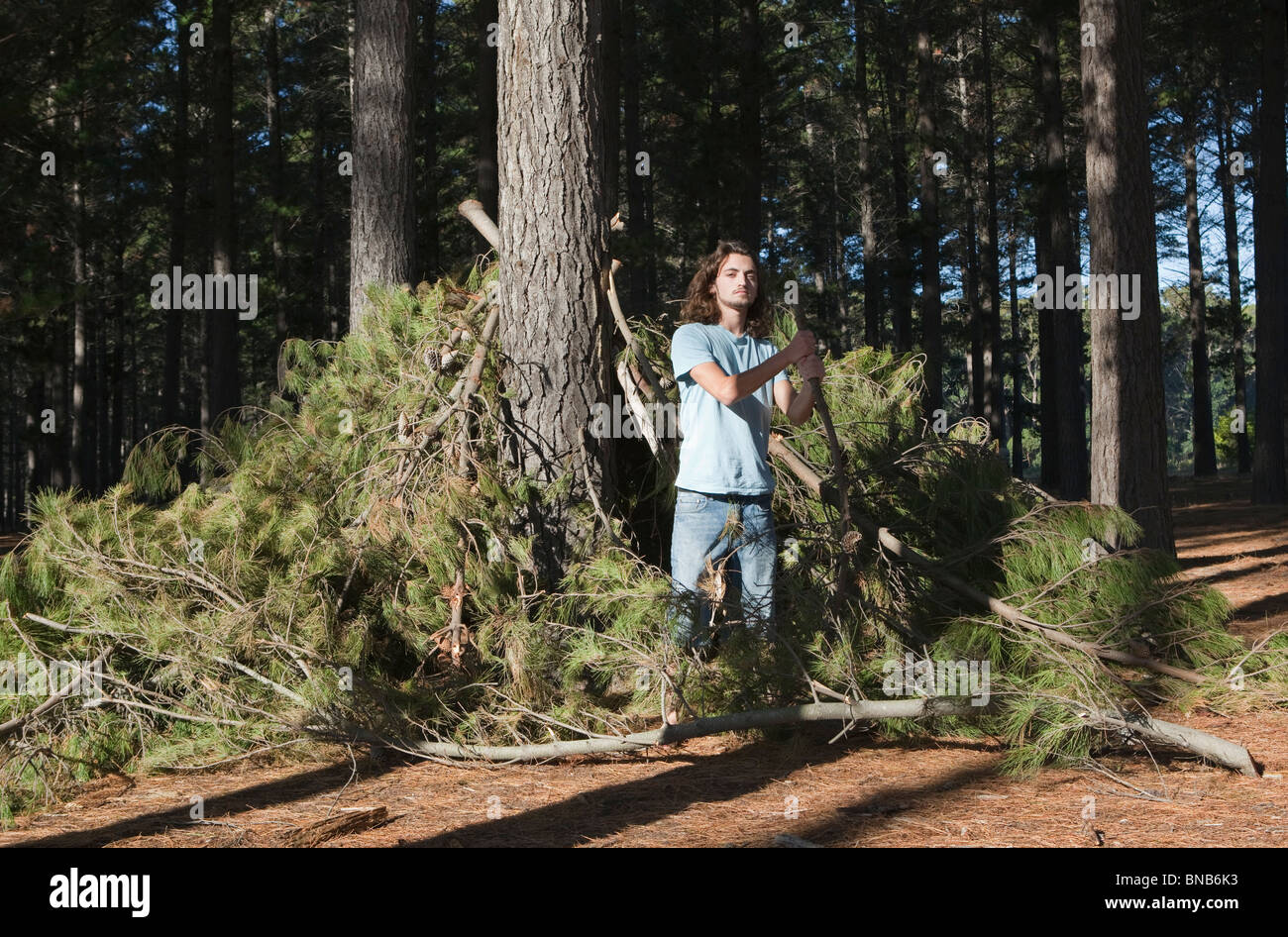 Man standing in forest Stock Photo - Alamy