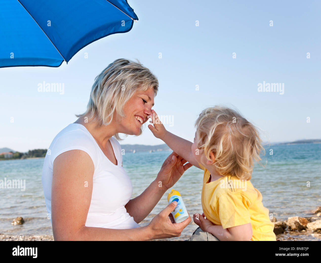 Mother and son at the beach Stock Photo - Alamy