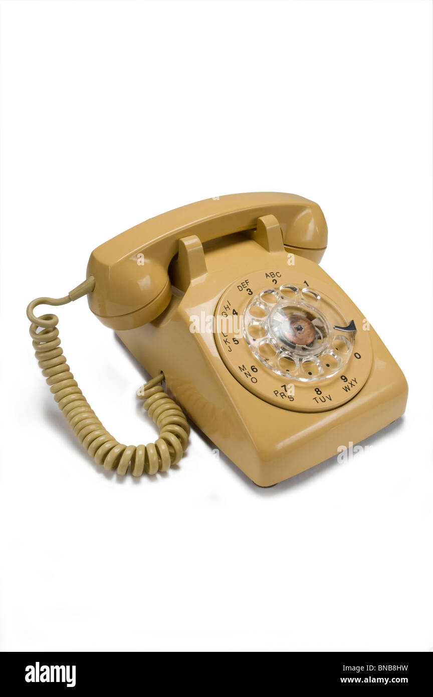 Old yellow dial telephone Stock Photo - Alamy
