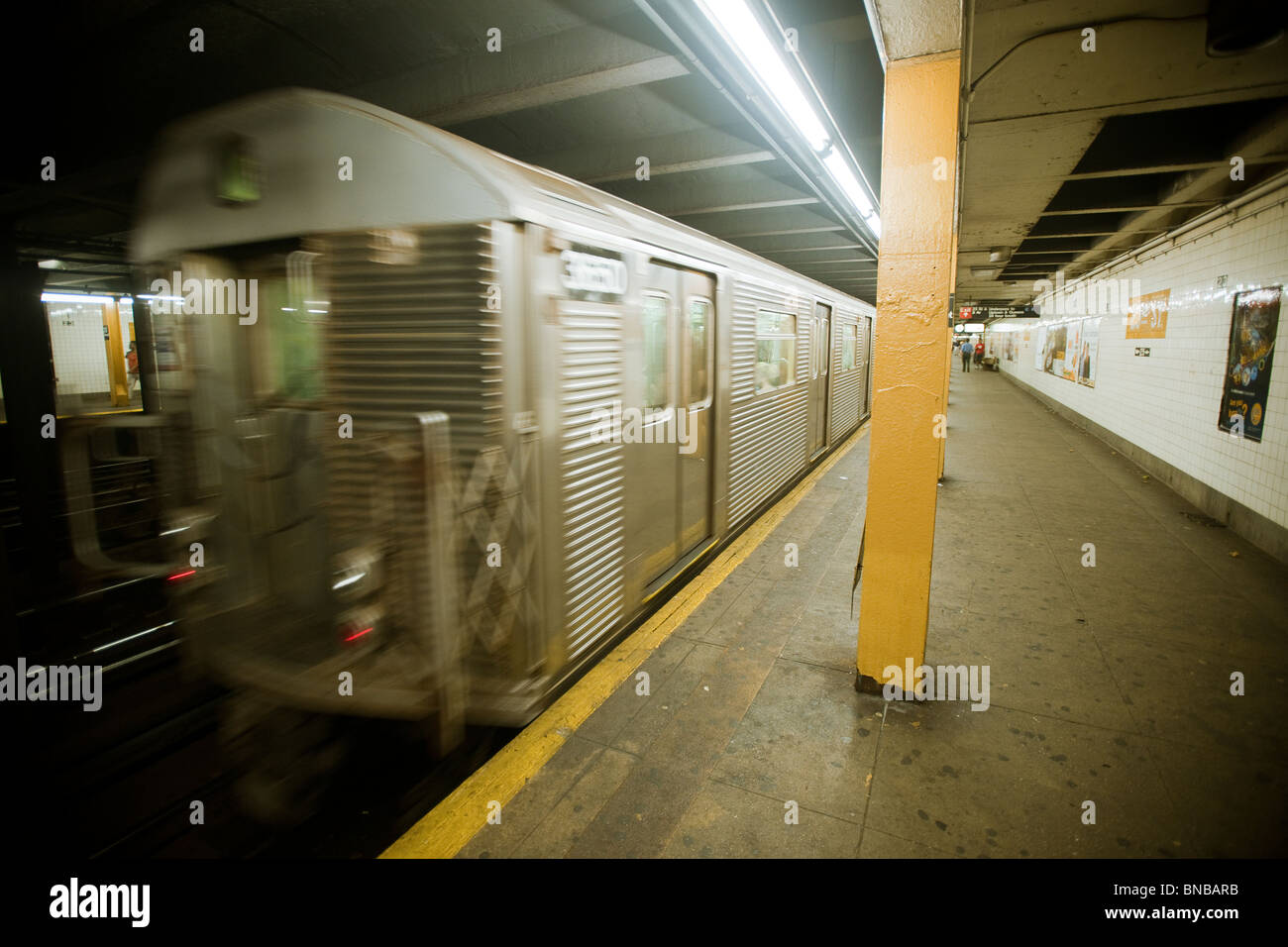 A C train departs the West 23rd Street station on the Eighth Avenue ...