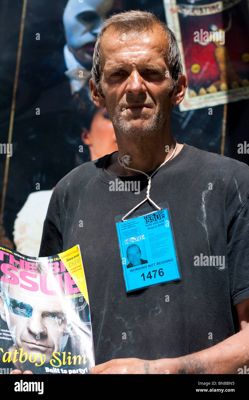 Homeless man selling copies of The Big Issue magazine, with the motto ...