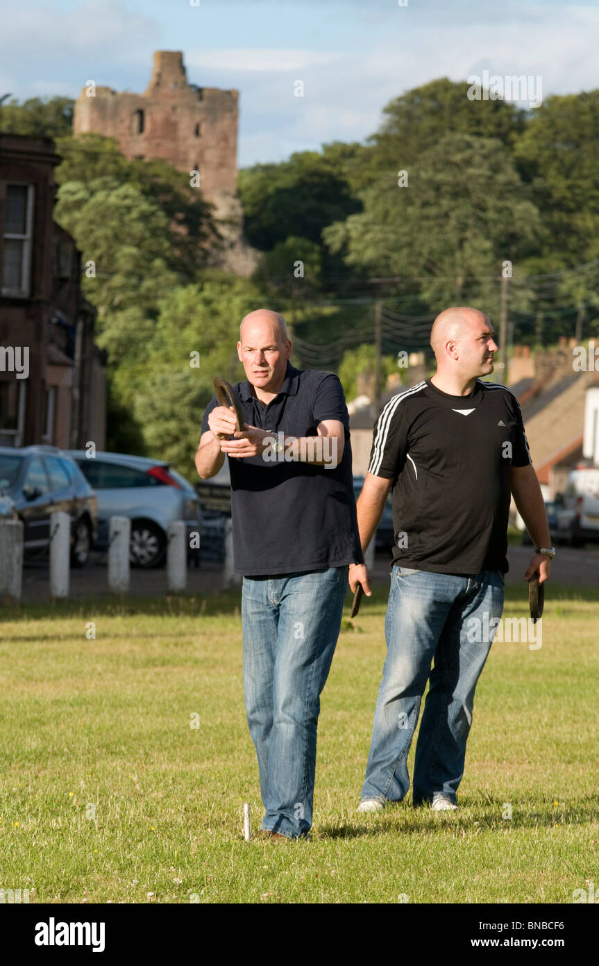 Playing quoits on Norham village green Stock Photo - Alamy