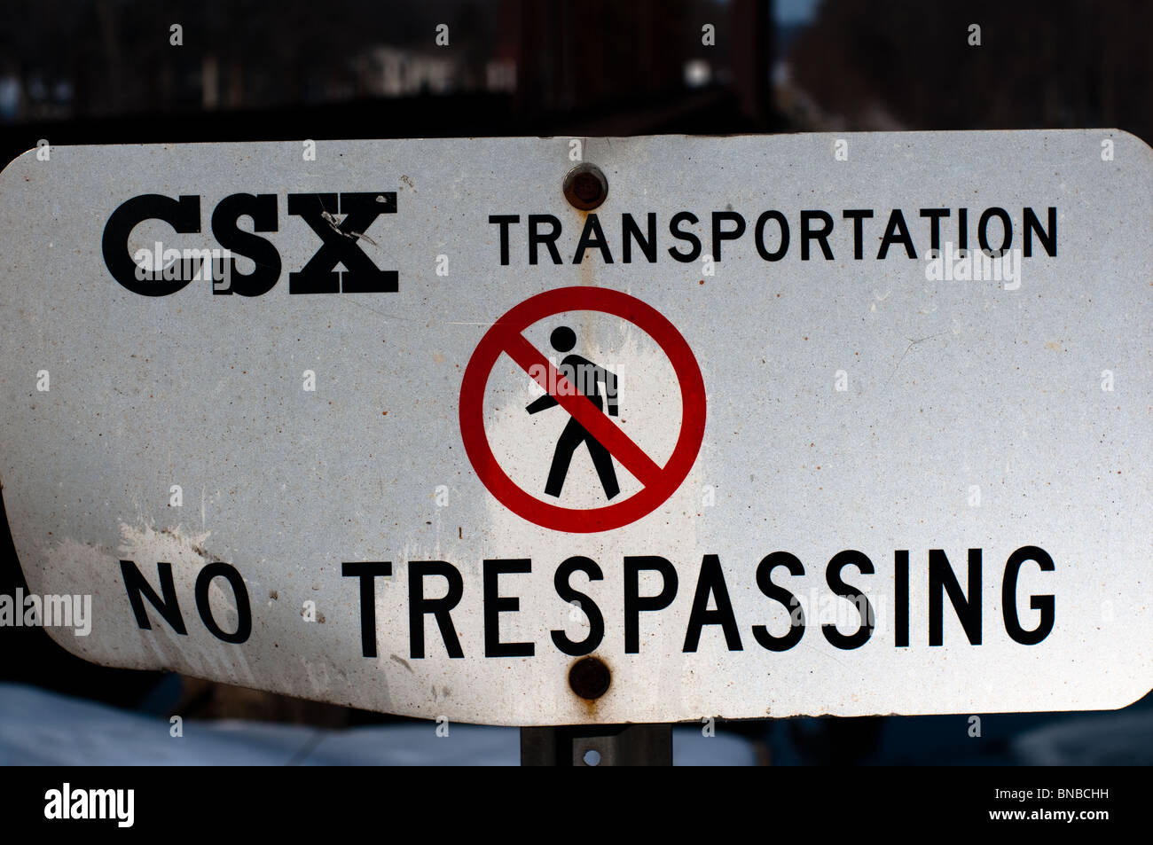 A CSX Railroad Transportation sign warning people of trespassing on the ...